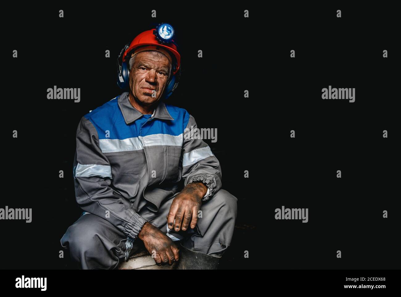 Miner happy man smiling after working on coal mine. Concept industrial ...