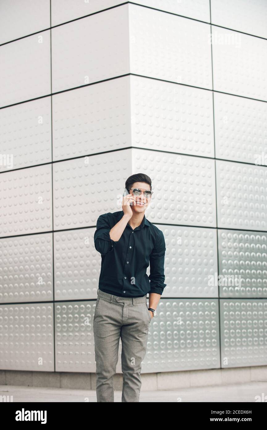 Cheerful guy speaking smartphone on hi-res stock photography and images ...
