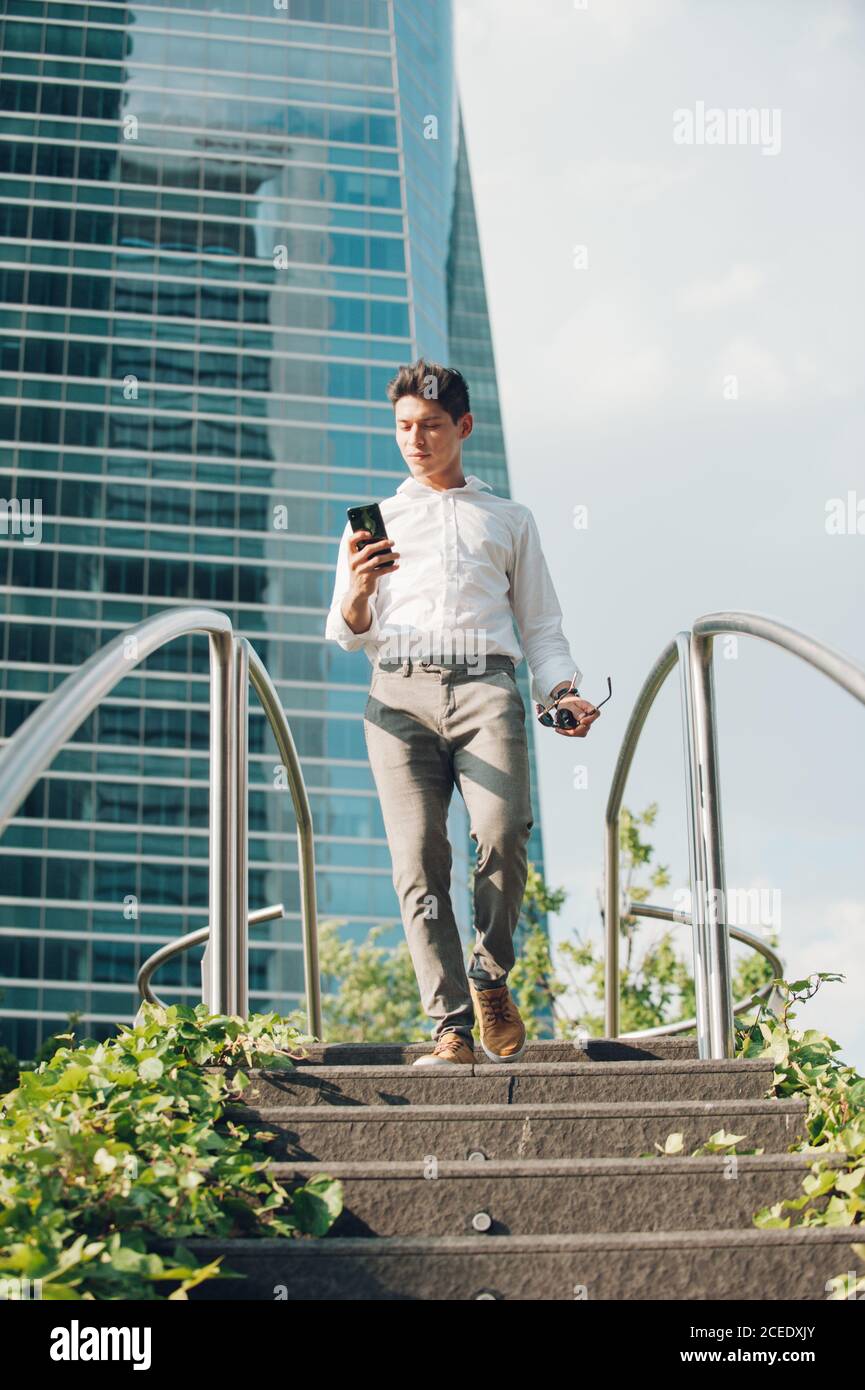 Man walking down steps hi-res stock photography and images - Alamy