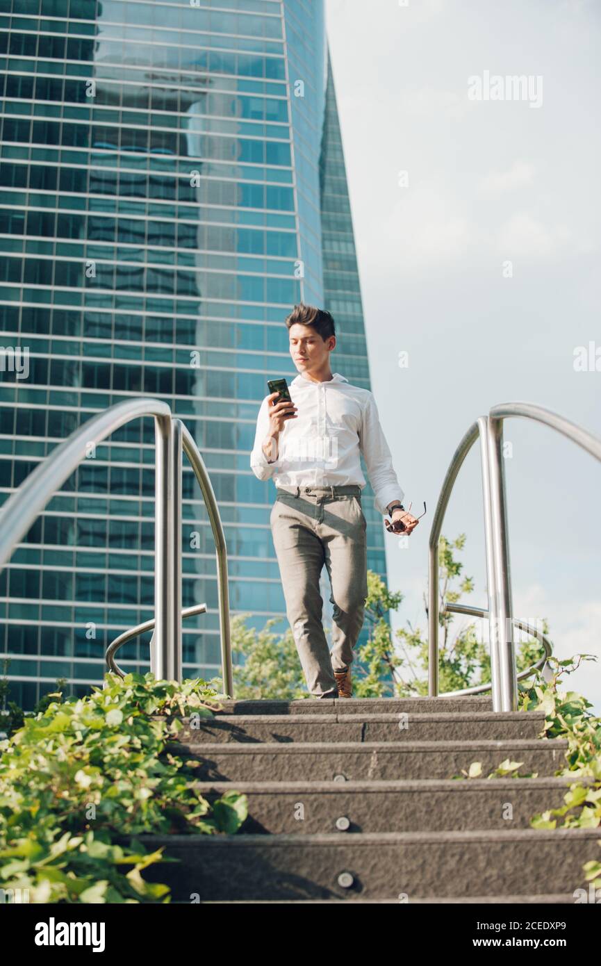 Man walking down steps hi-res stock photography and images - Alamy