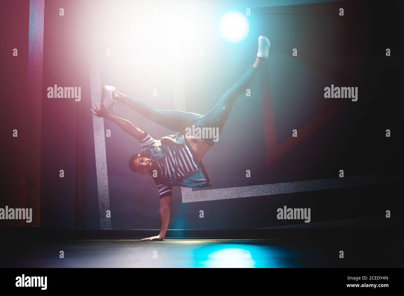 man performing dance in spotlights Stock Photo - Alamy