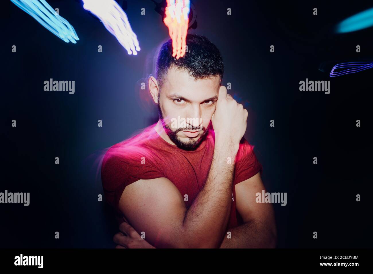 Handsome bearded man dancing in spotlight Stock Photo - Alamy