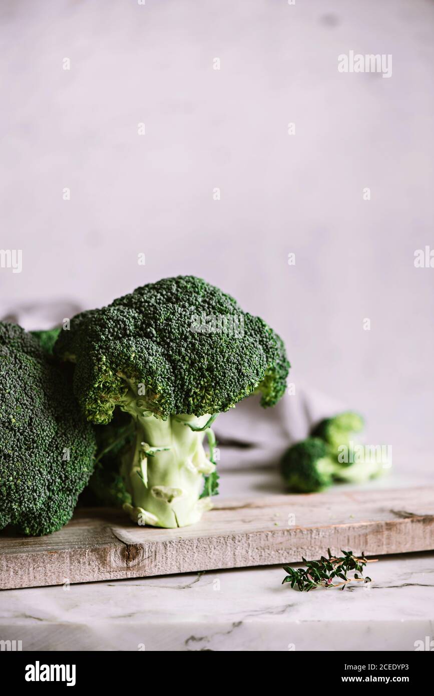 Broccoli trees on wood piece Stock Photo - Alamy