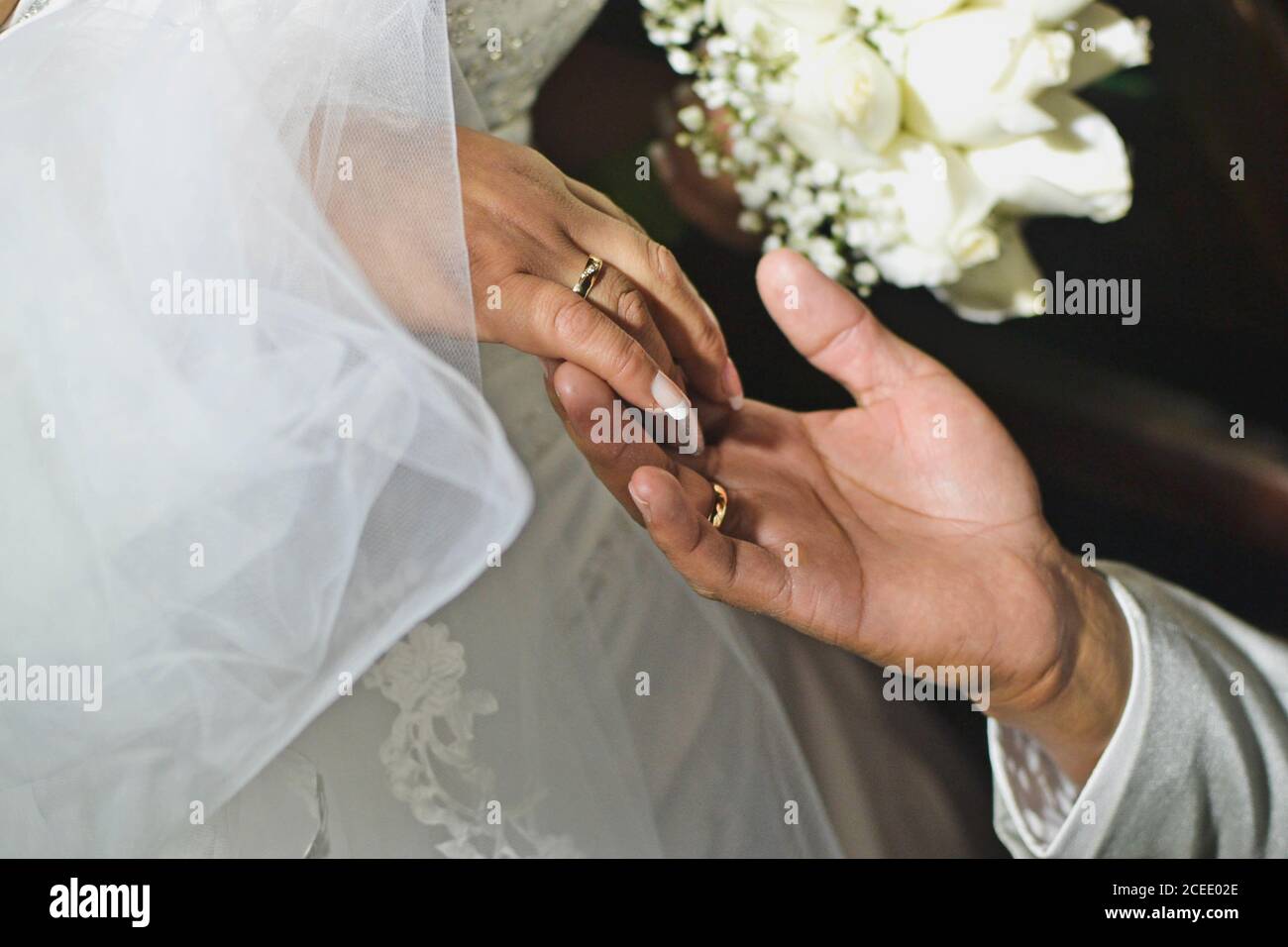 Hands of the bride and the groom touching each other gently Stock Photo ...
