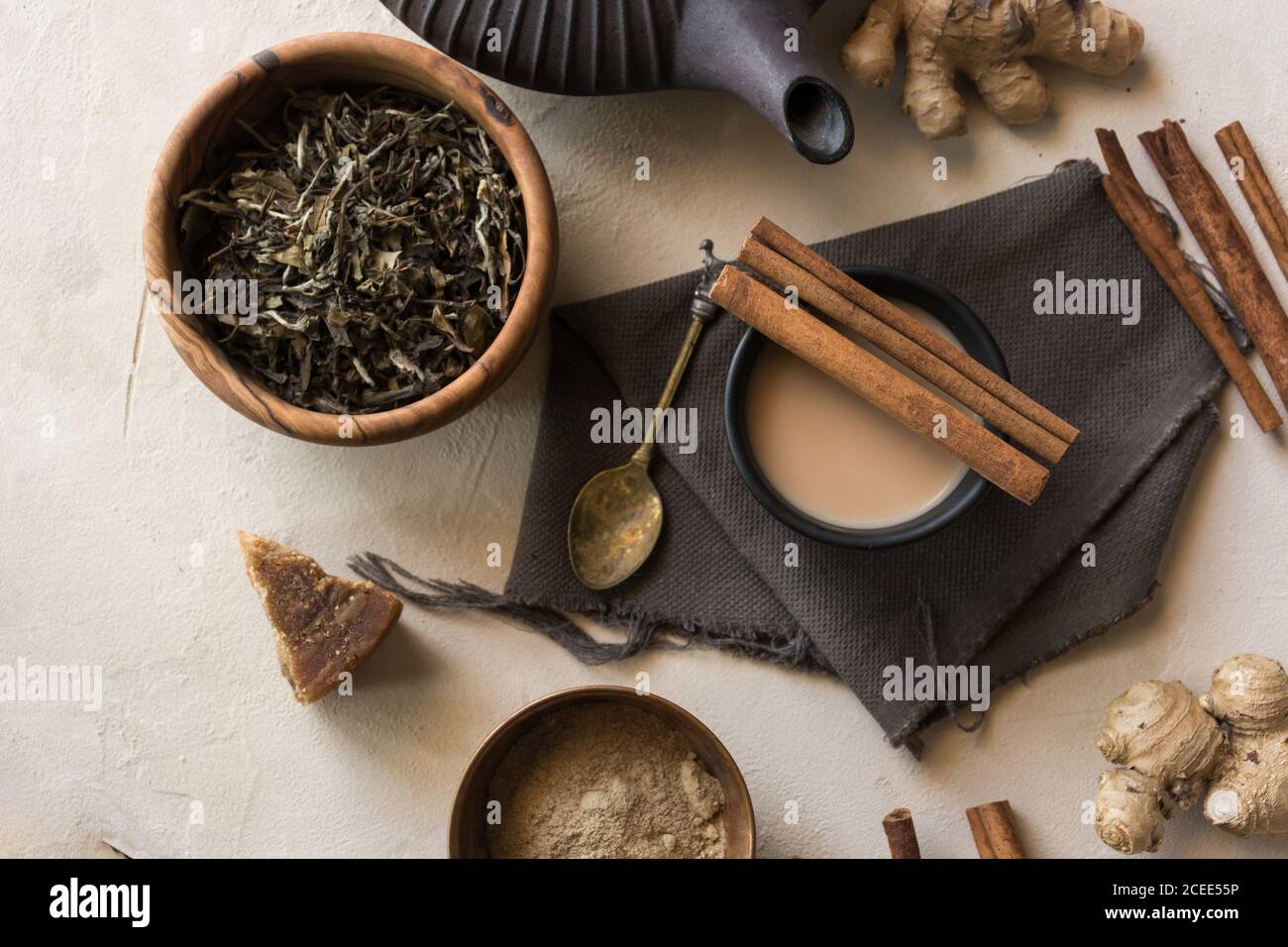 Oriental cup of tea Chai, Its ingredients with milk, cinnamon, ginger ...