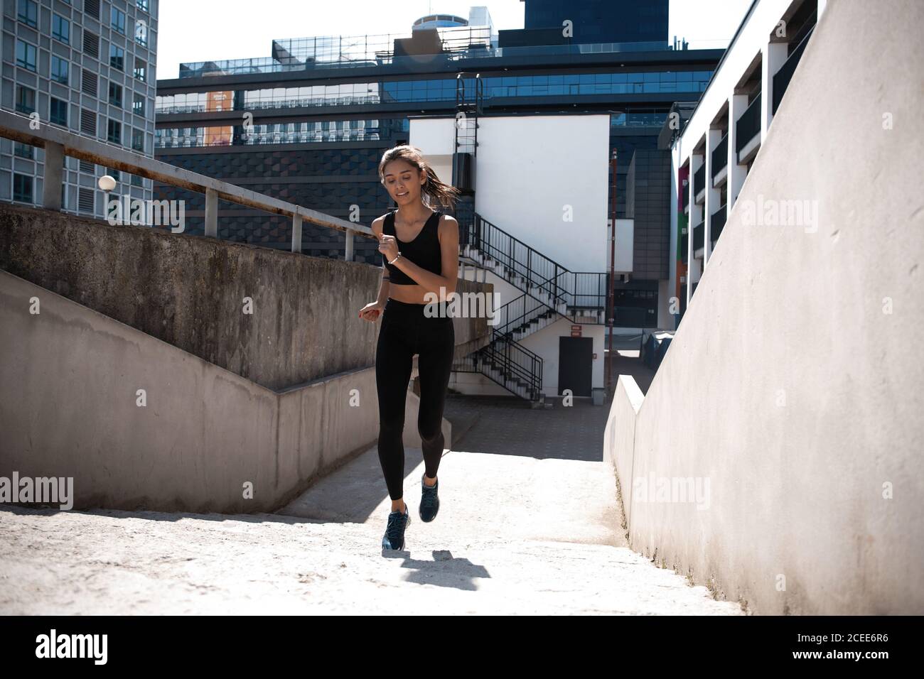 Portrait of a healthy young woman running outdoors Stock Photo - Alamy