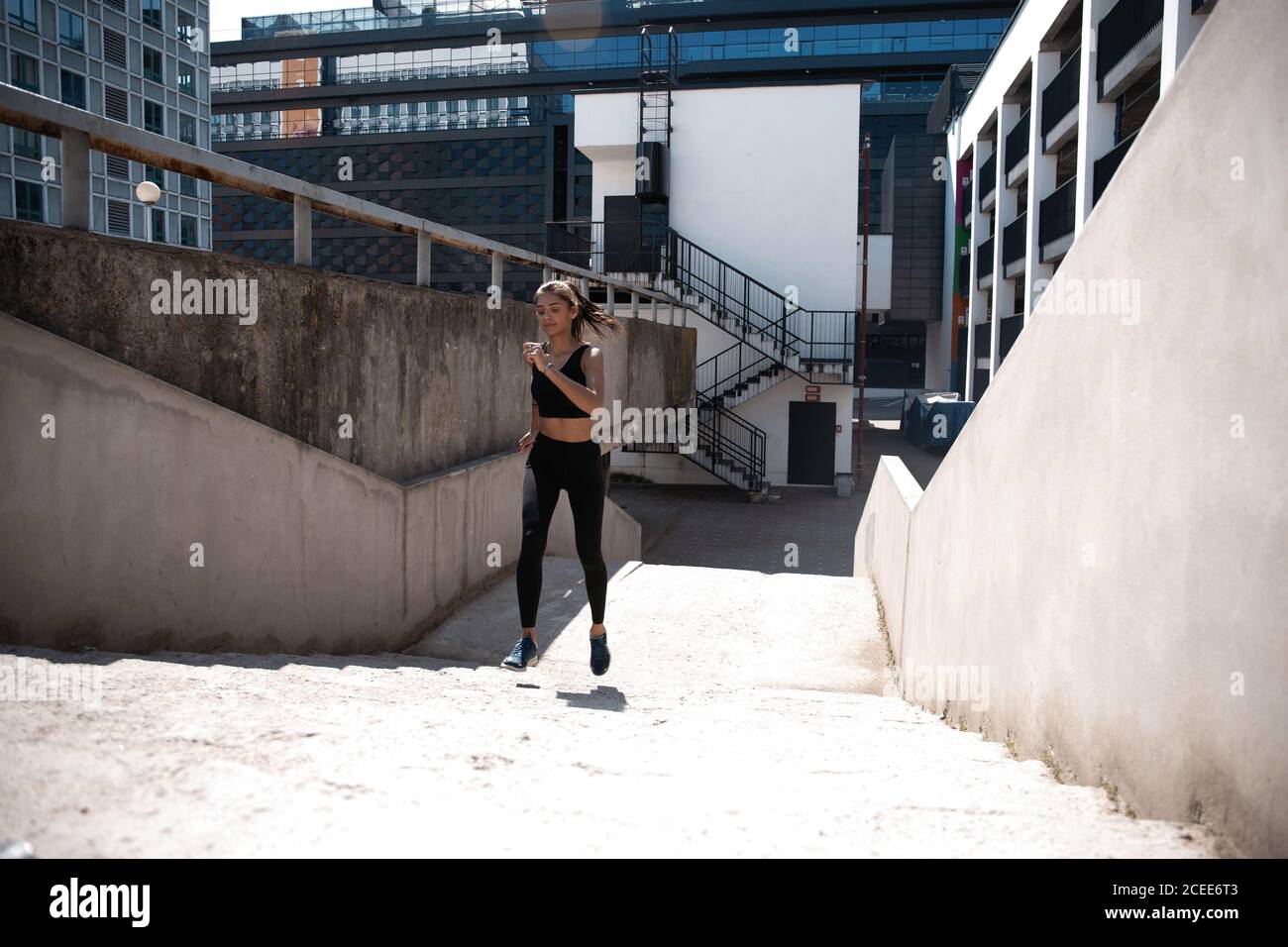Portrait of a healthy young woman running outdoors Stock Photo - Alamy