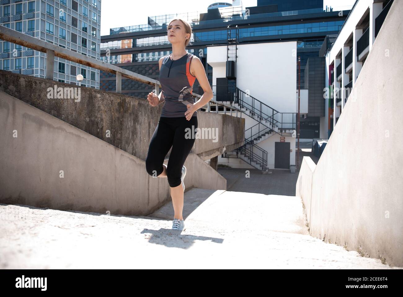 Portrait of a healthy young woman running outdoors Stock Photo - Alamy