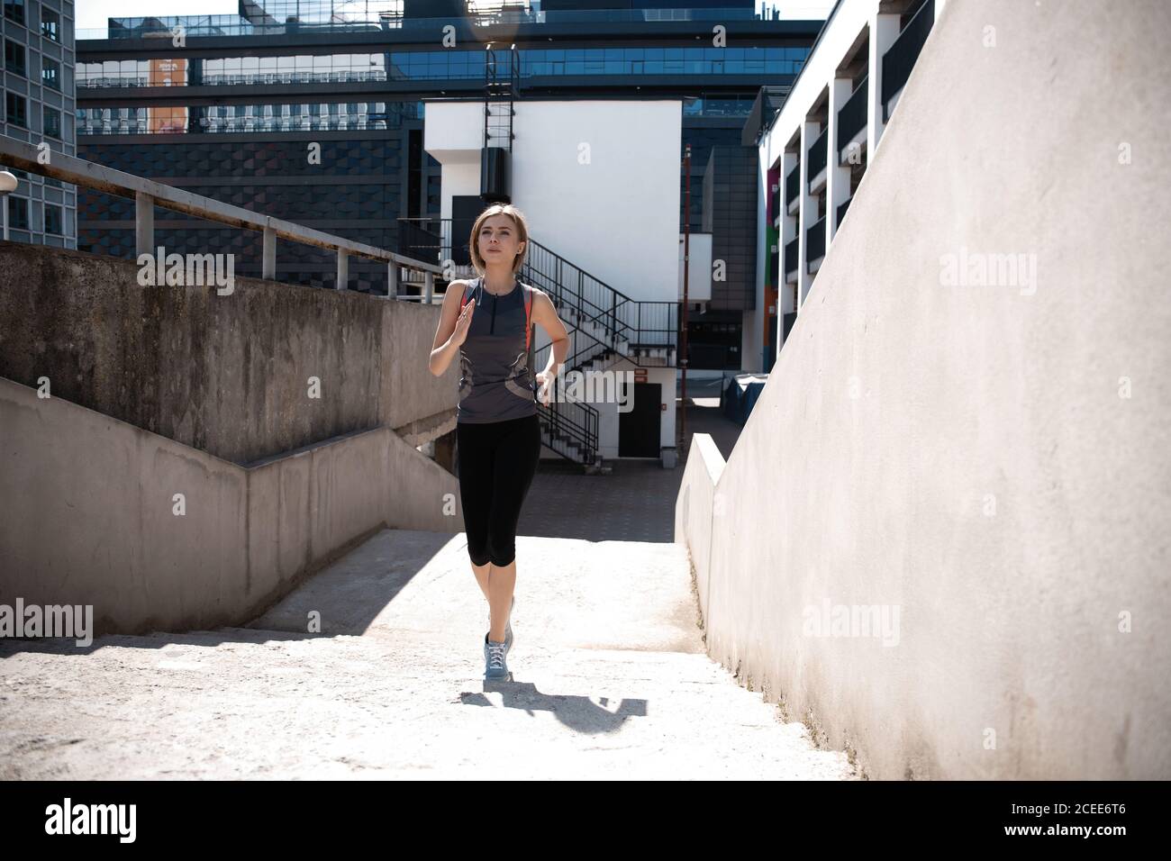 Portrait of a healthy young woman running outdoors Stock Photo - Alamy