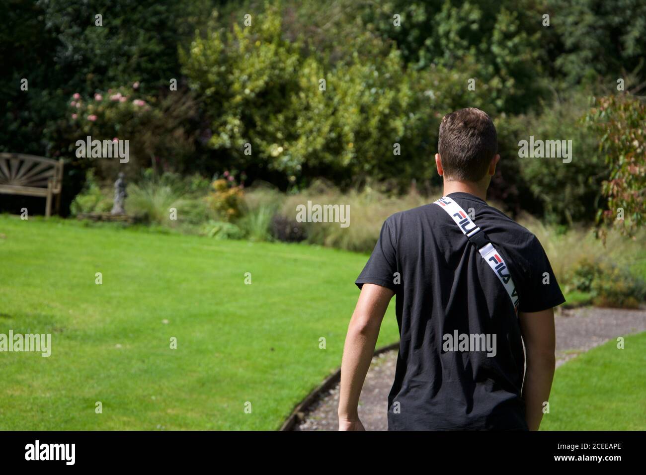 Man Walking Through Burrow Farm Gardens Stock Photo - Alamy