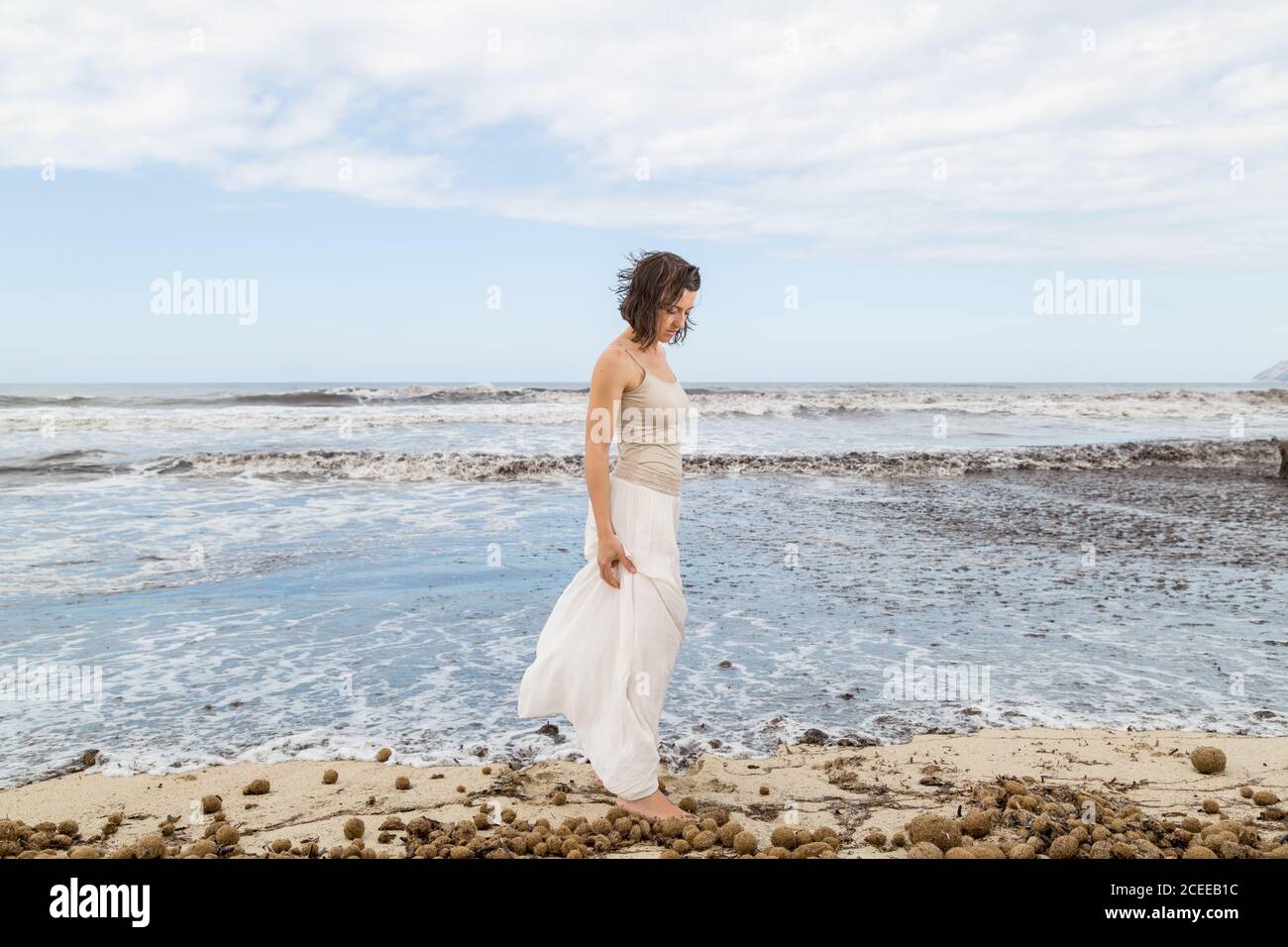 Charming young Woman on shore near water Stock Photo - Alamy