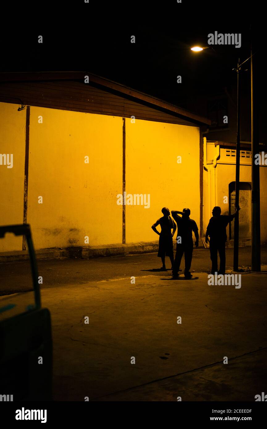 Standing under street lamp hi-res stock photography and images - Alamy