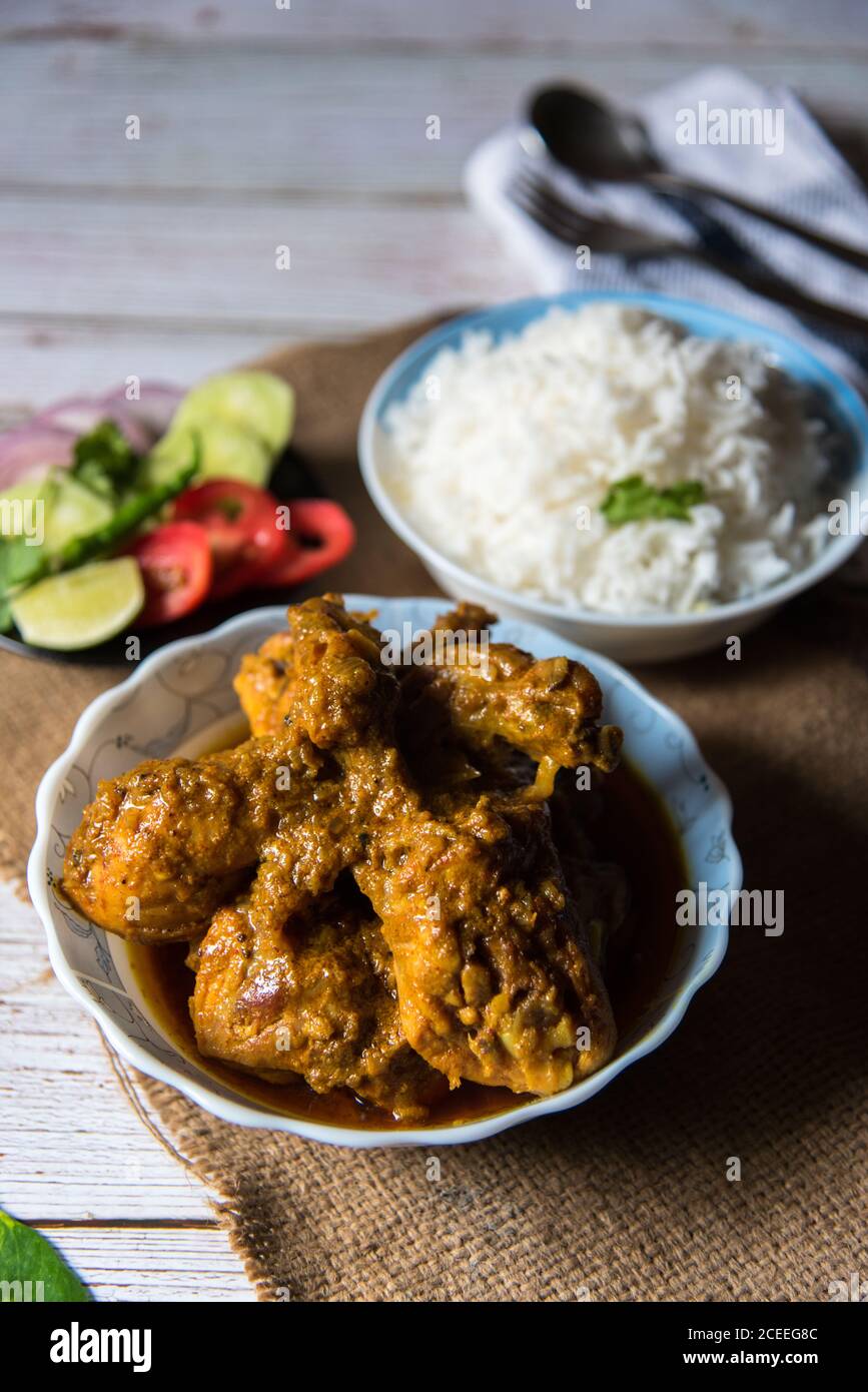 Close up of fried chicken wings with rice with salad prepared Indian ...