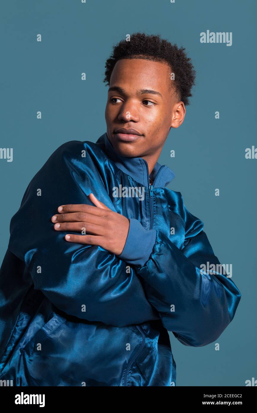 anonymous black man in blue outfit Stock Photo - Alamy