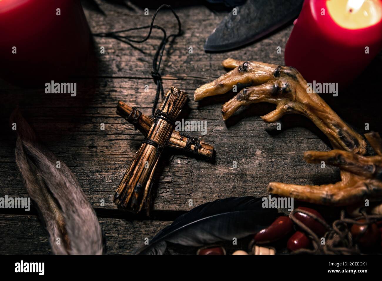Dark voodoo or vodun ritual with puppet, crow´s feet and rabbit ear ...