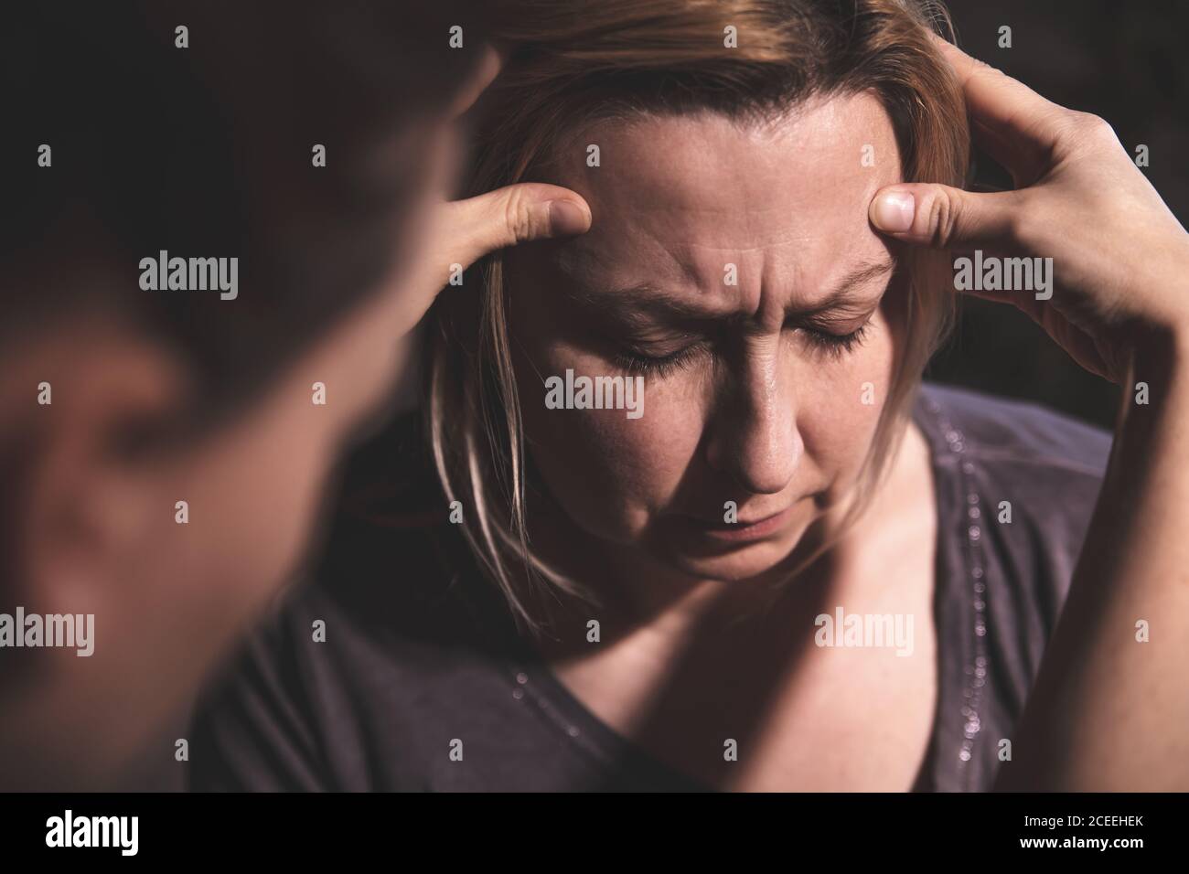 Two women touching forehead hi-res stock photography and images - Alamy