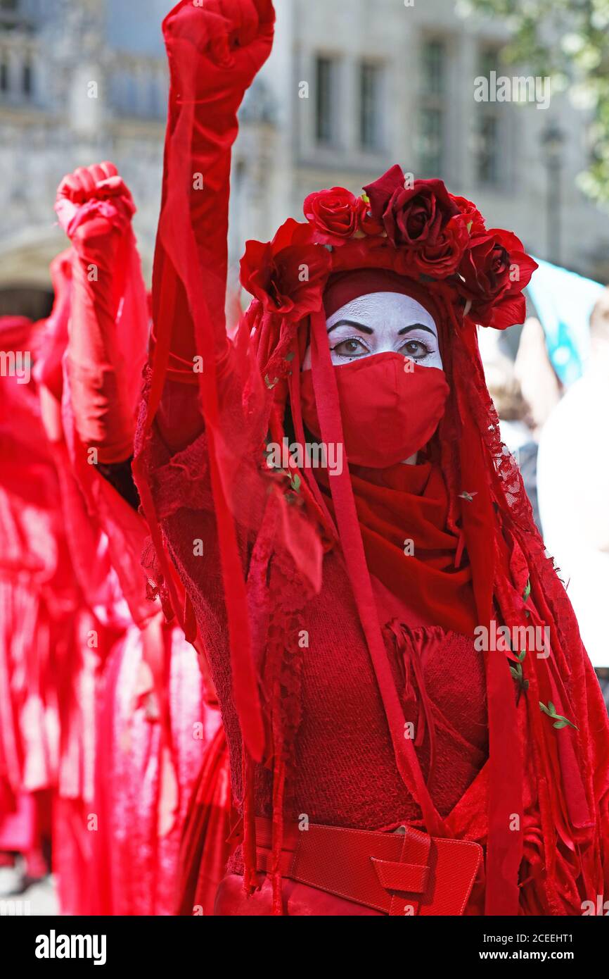 Members of the 'Red Brigade' take part in an Extinction Rebellion ...