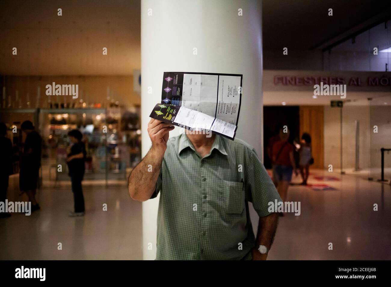 Man holding object in front of face hi-res stock photography and images ...