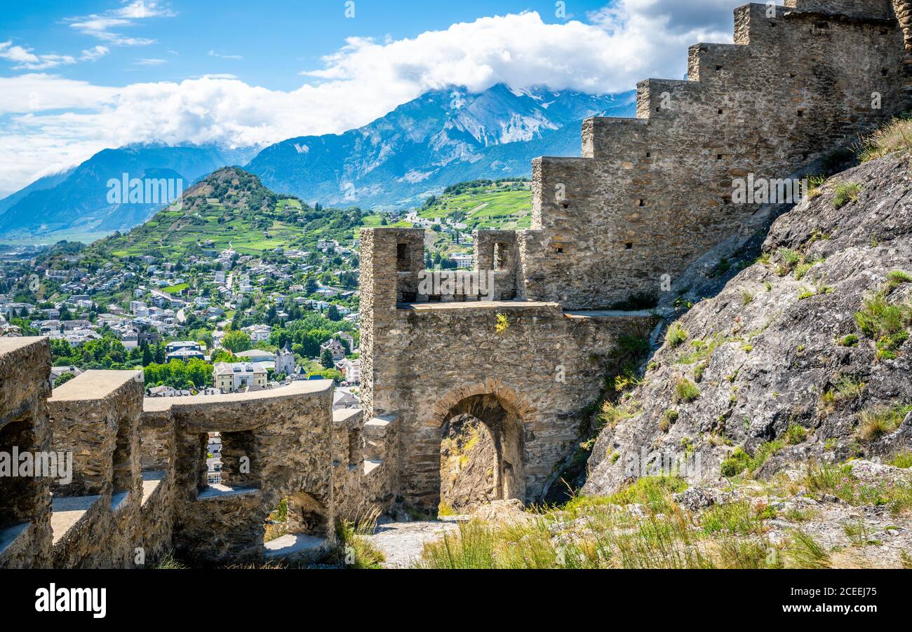Entrance door and wall of the ruins of Tourbillon castle and Sion hill ...