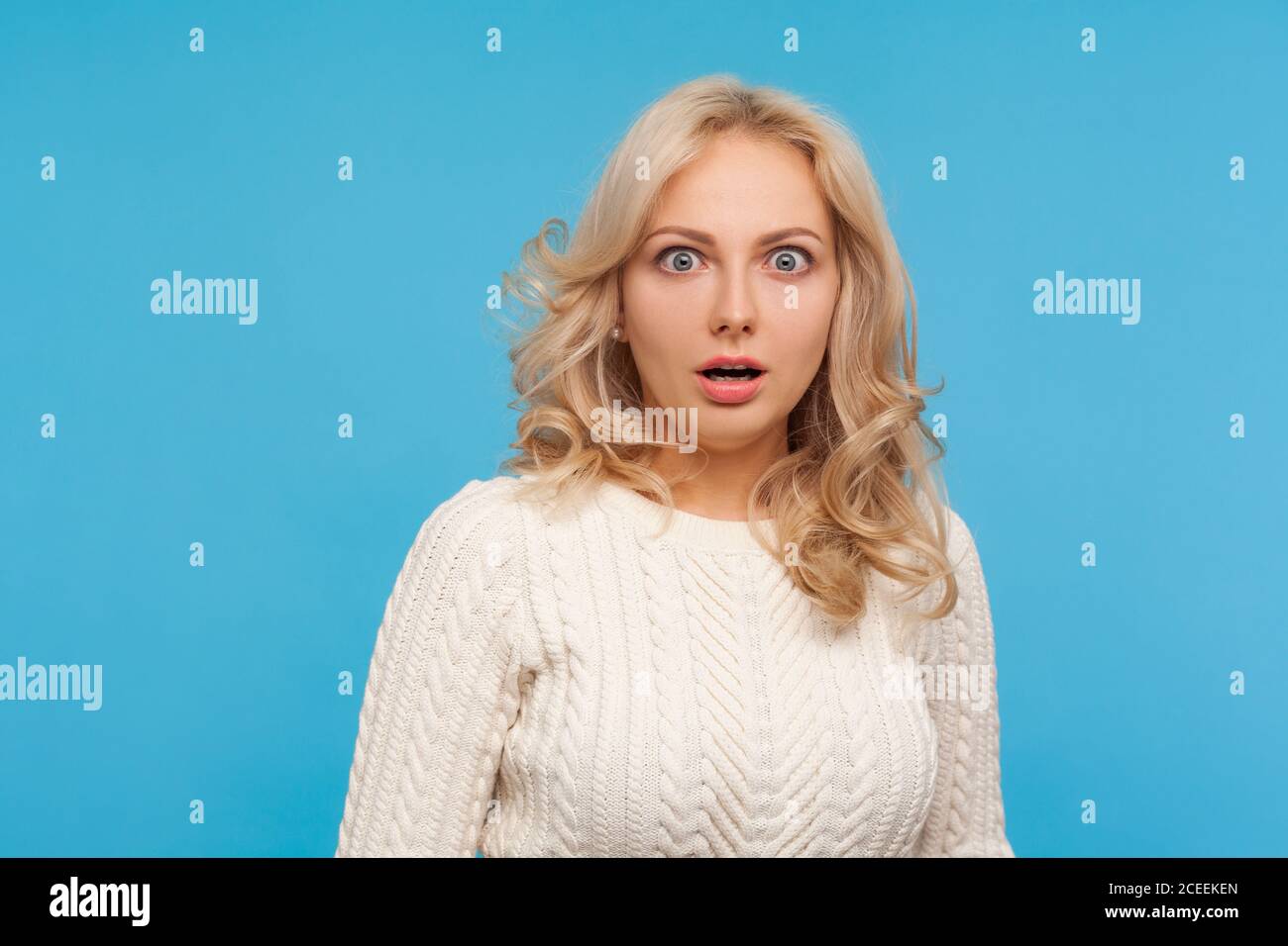 Closeup surprised confused woman looking at camera with big eyes and ...