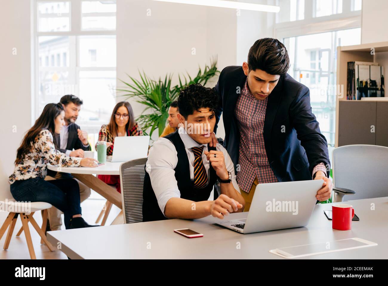 Multiethnic office team at work Stock Photo - Alamy