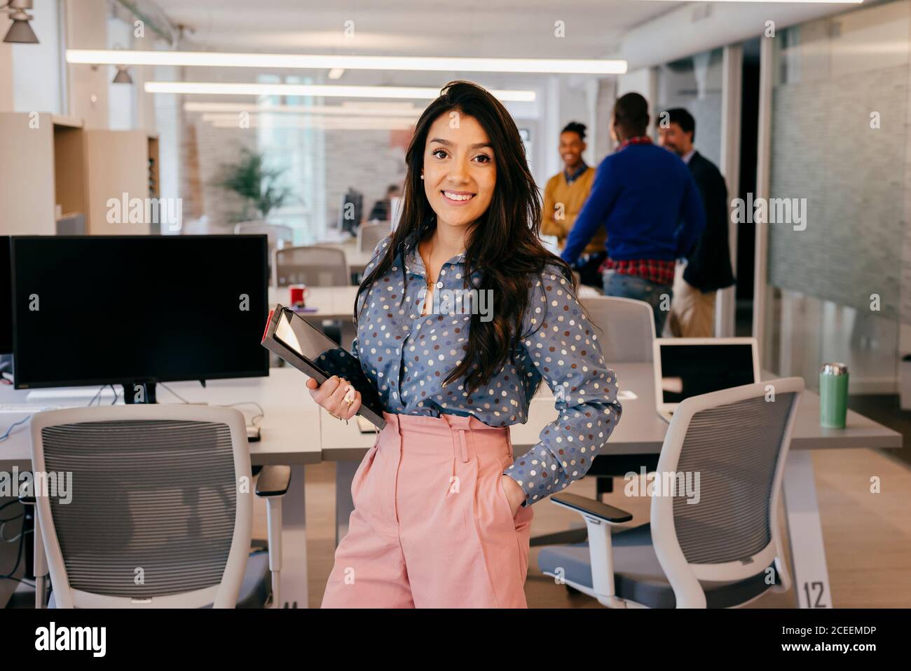Office staff smiling hi-res stock photography and images - Alamy