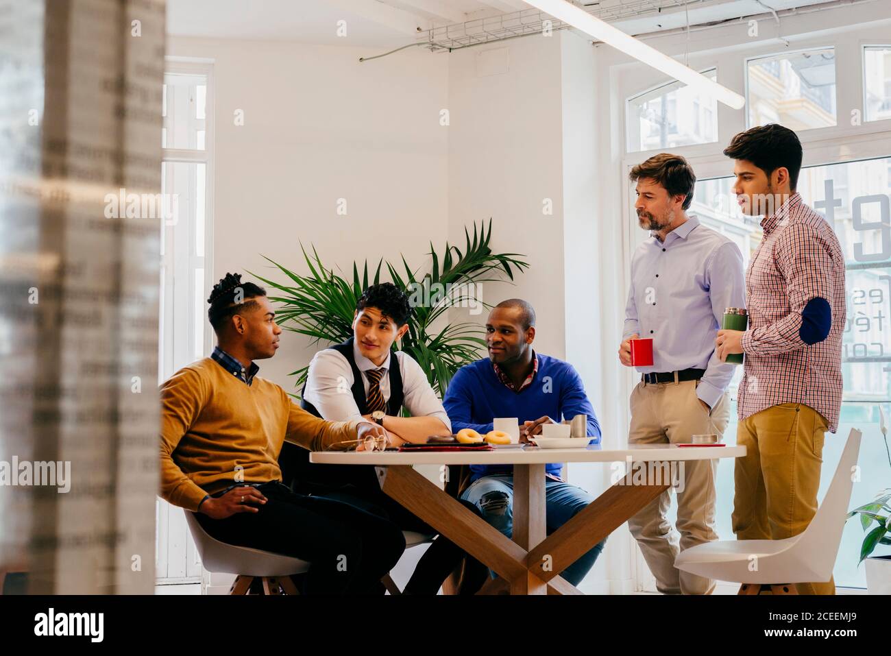 Cheerful men in the office Stock Photo - Alamy