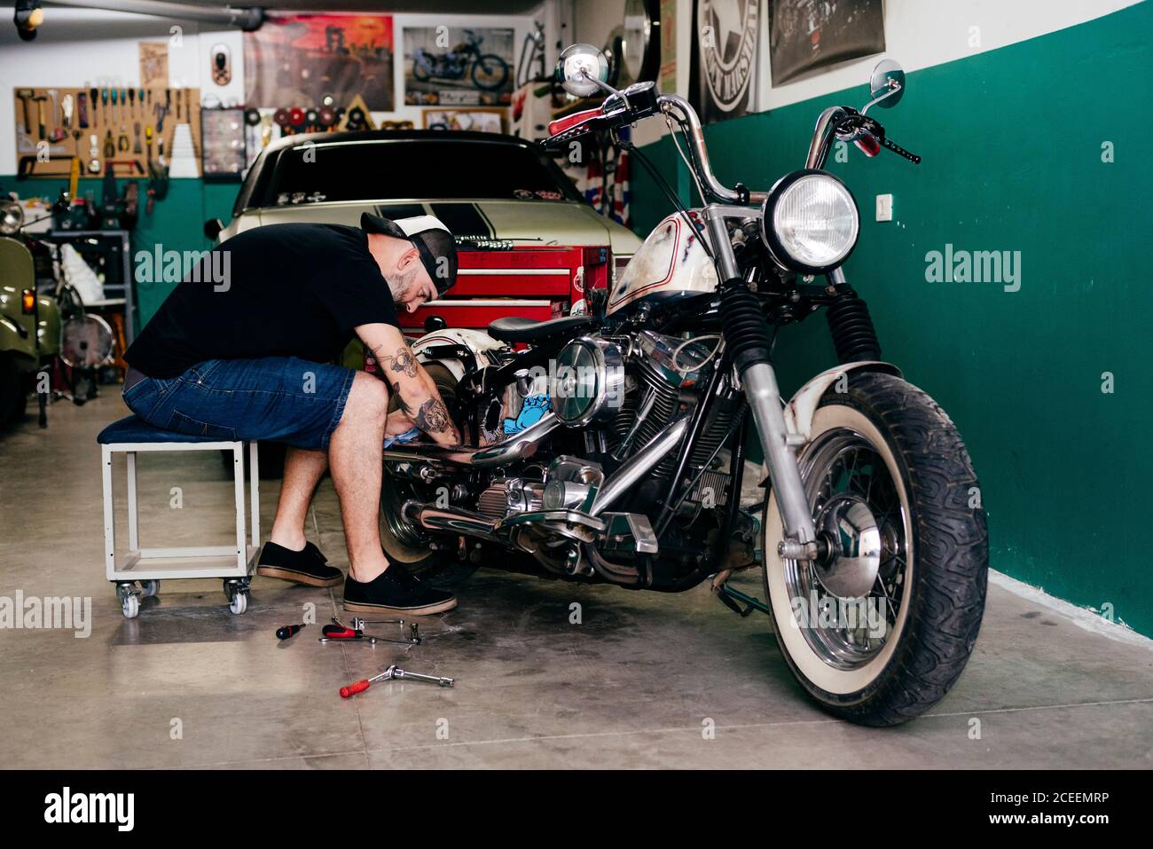 Mechanic repairing vehicle sitting hi-res stock photography and images ...