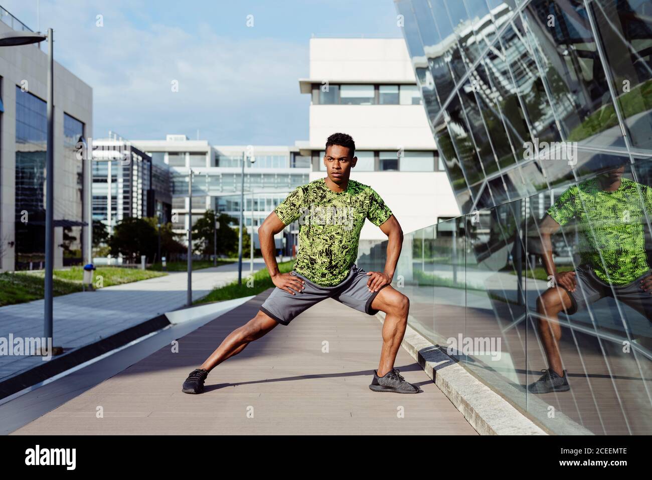 African american man stretching legs hi-res stock photography and ...