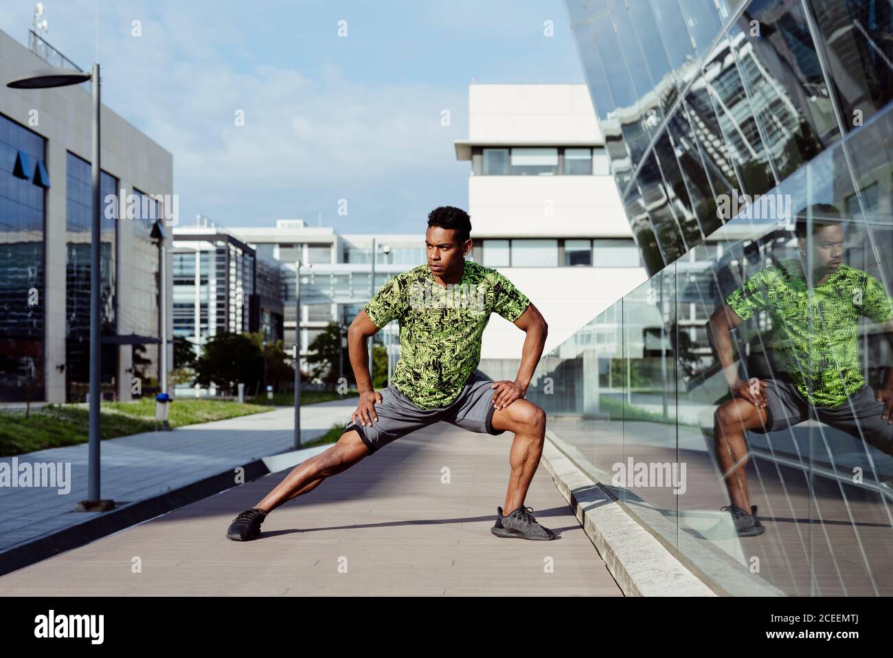 African american man stretching legs hi-res stock photography and ...