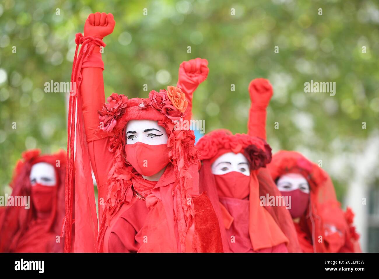 Members of the 'Red Brigade' take part in an Extinction Rebellion ...