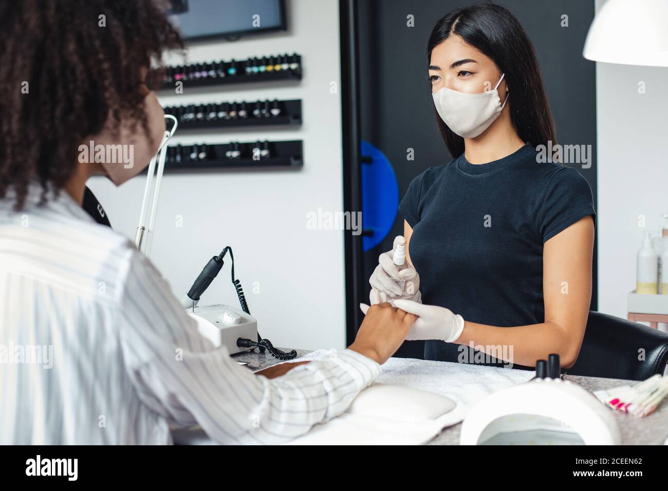 Girl in protective mask manicure hi-res stock photography and images ...
