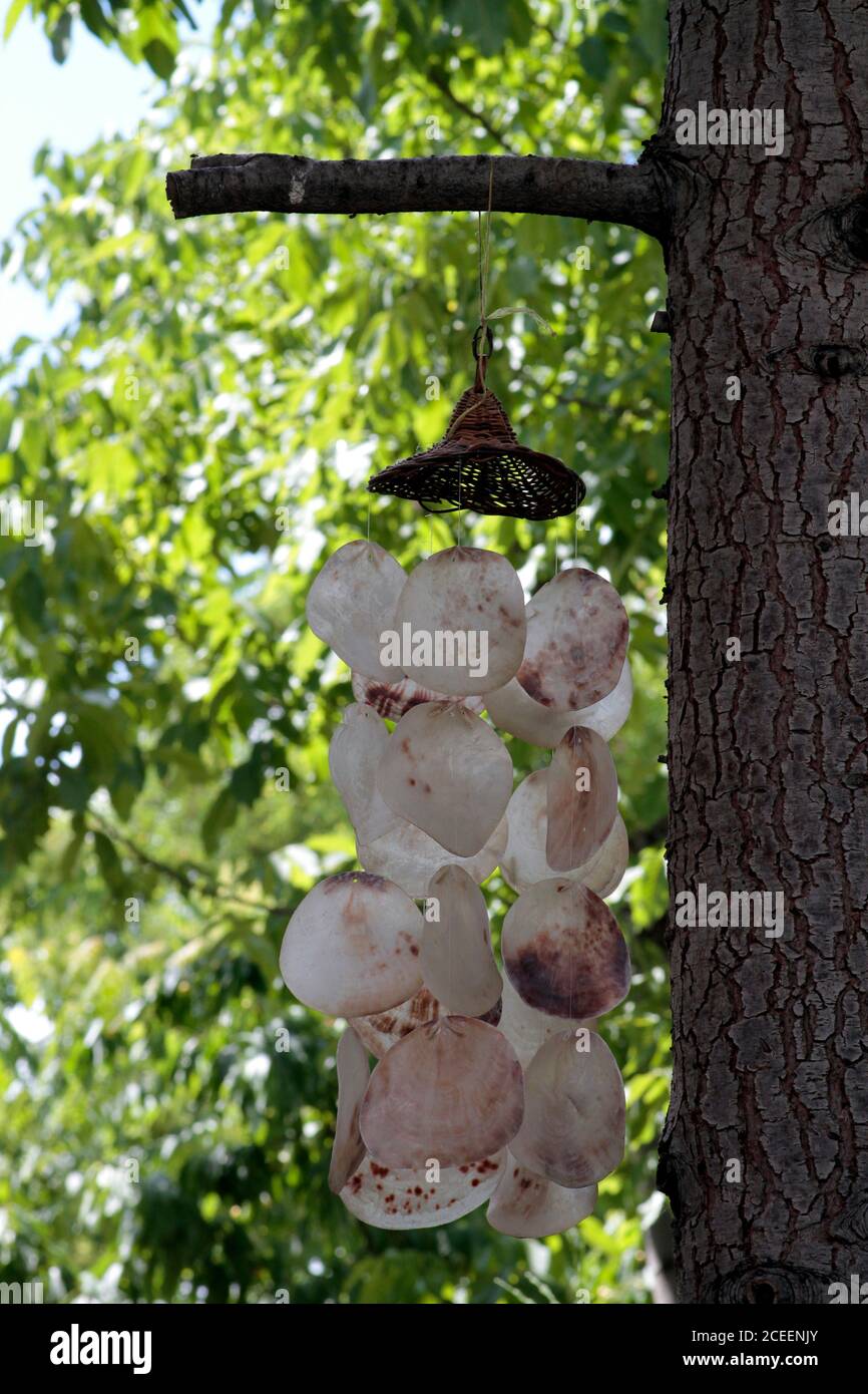 Wind chime making soothing sounds in the wind. The garden decoration ...