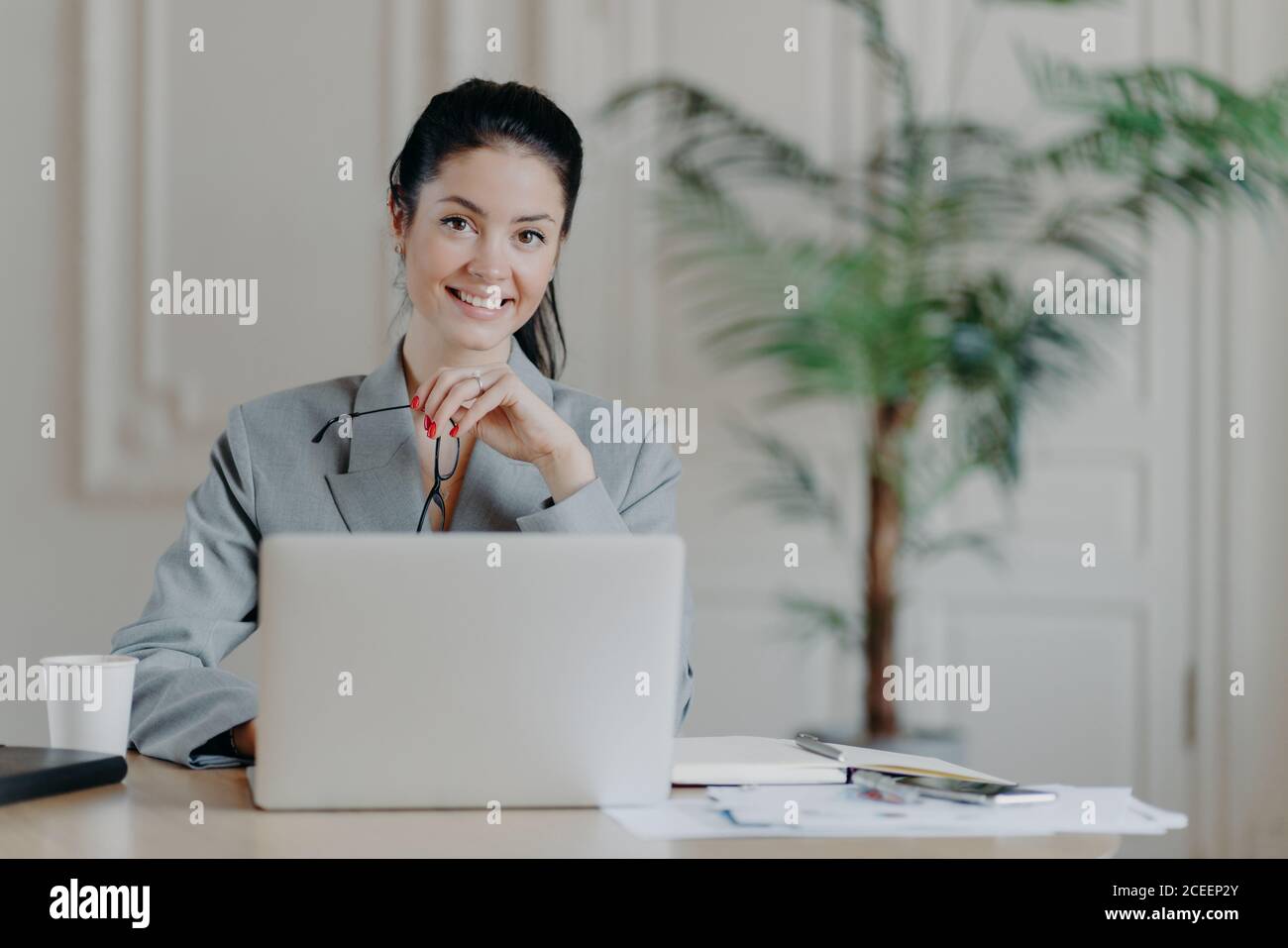 Entrepreneur in eyeglasses works hi-res stock photography and images ...