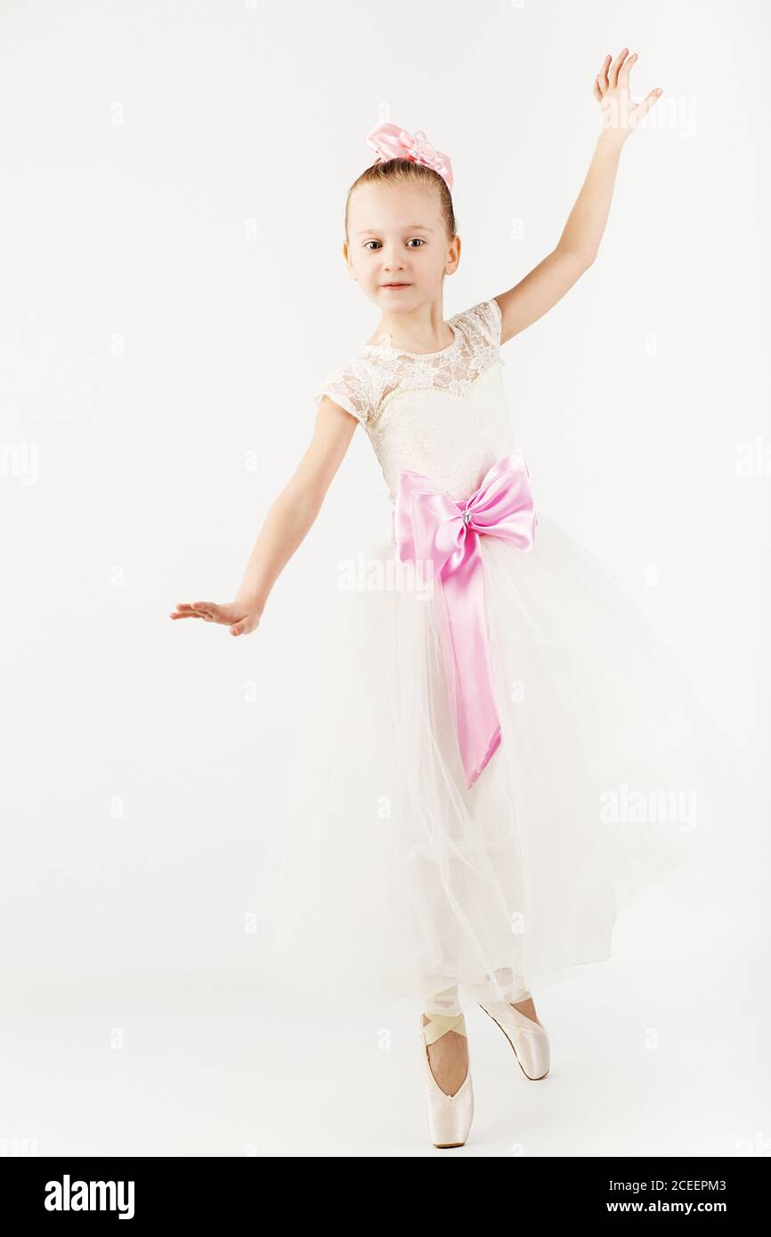 Beautiful ballet dancer isolated on white background. Slender little ...