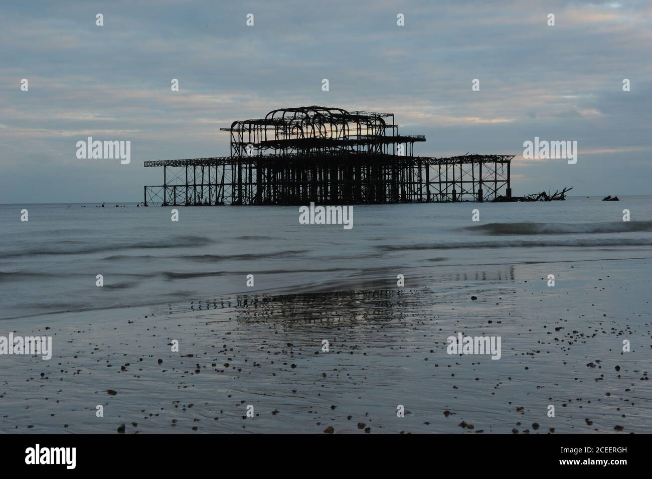 The silhouetted outline of Brighton's ruined burnt out West Pier ...