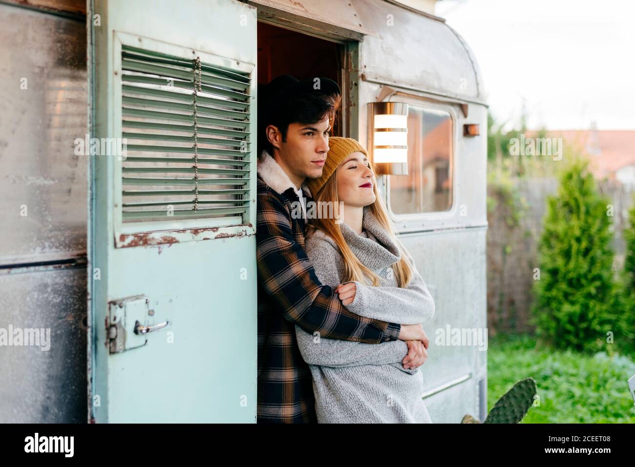 Couple hugging camper van hi-res stock photography and images - Alamy