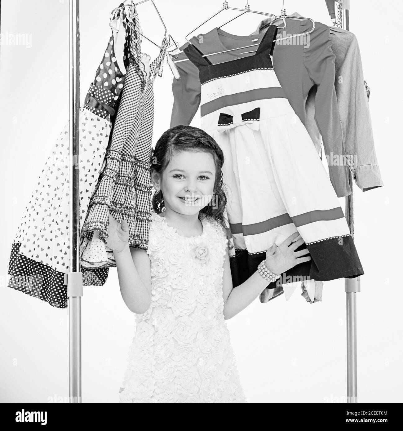 Little girl clothes choosing Black and White Stock Photos & Images - Alamy Little girl clothes choosing Black and White Stock Photos & Images - Alamy