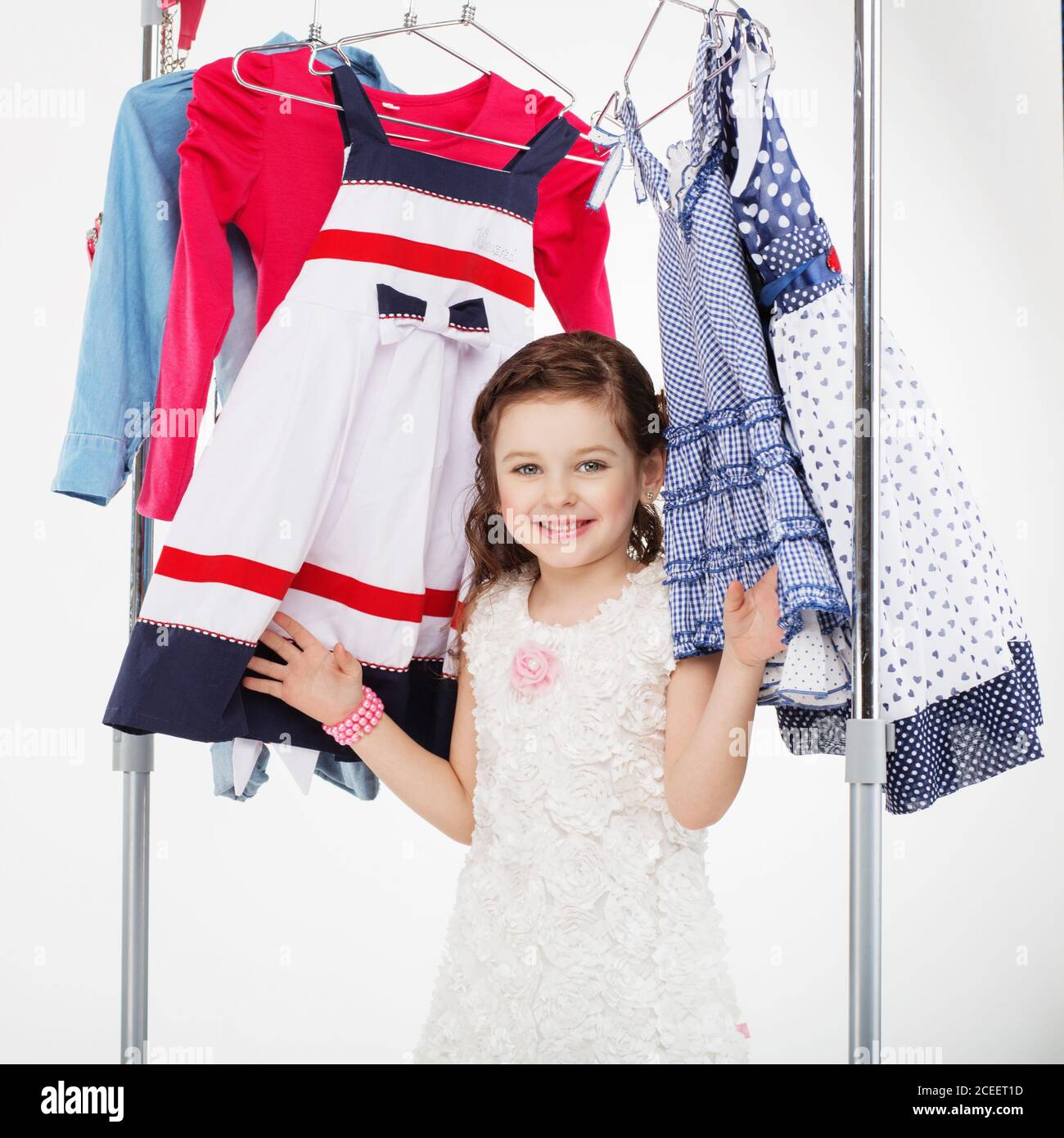 Child girl trying on new clothes hi-res stock photography and images ...