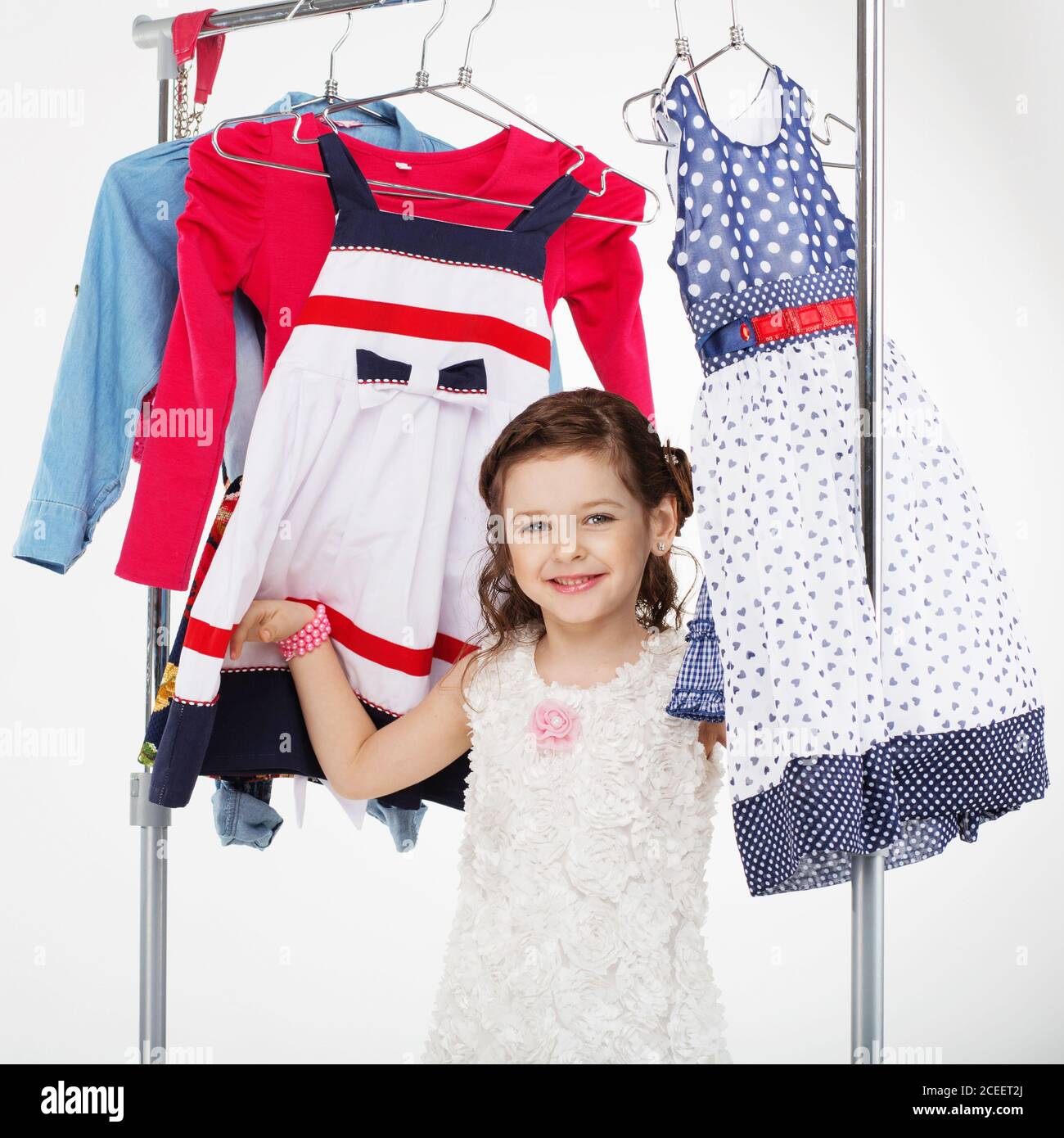 Child girl trying on new clothes hi-res stock photography and images ...