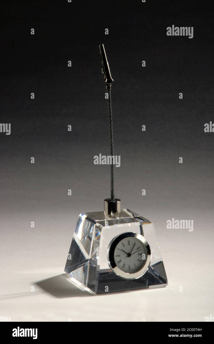 A desk clock with a metal area for promotion, branding, emblem or ...