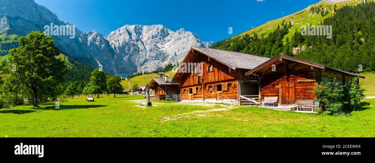 panorama landscape in alpine mountains with farmhouse Stock Photo - Alamy