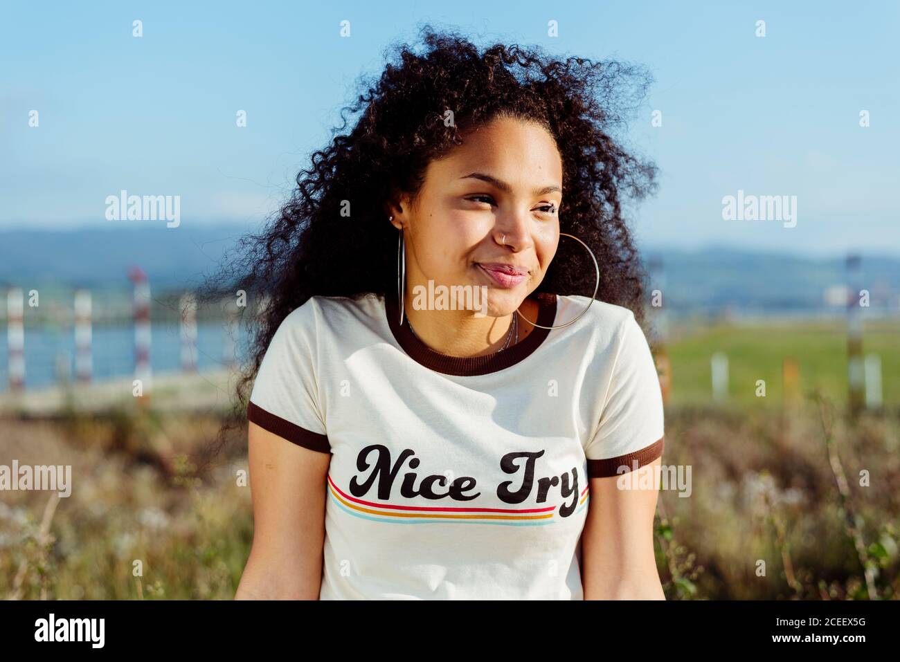 Cheerful African-American Woman in countryside Stock Photo - Alamy