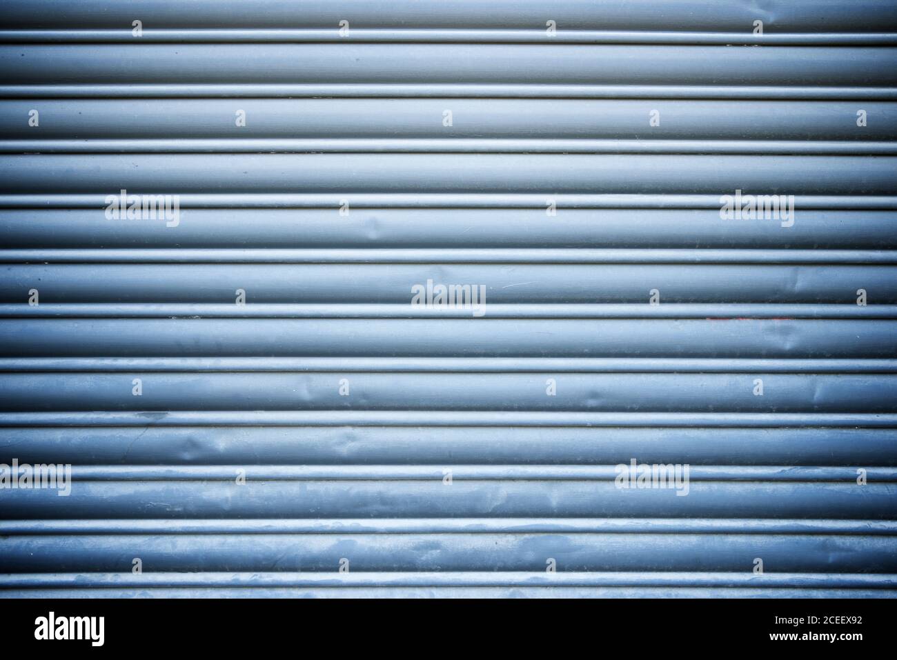 Front view of the metal roller shutter of a store Stock Photo - Alamy