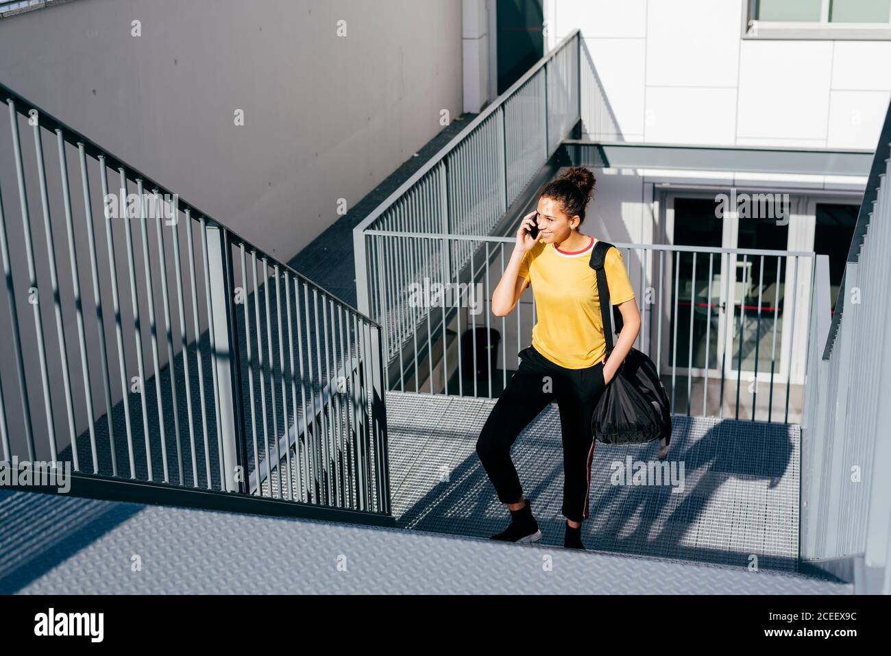 Woman going upstairs hi-res stock photography and images - Alamy