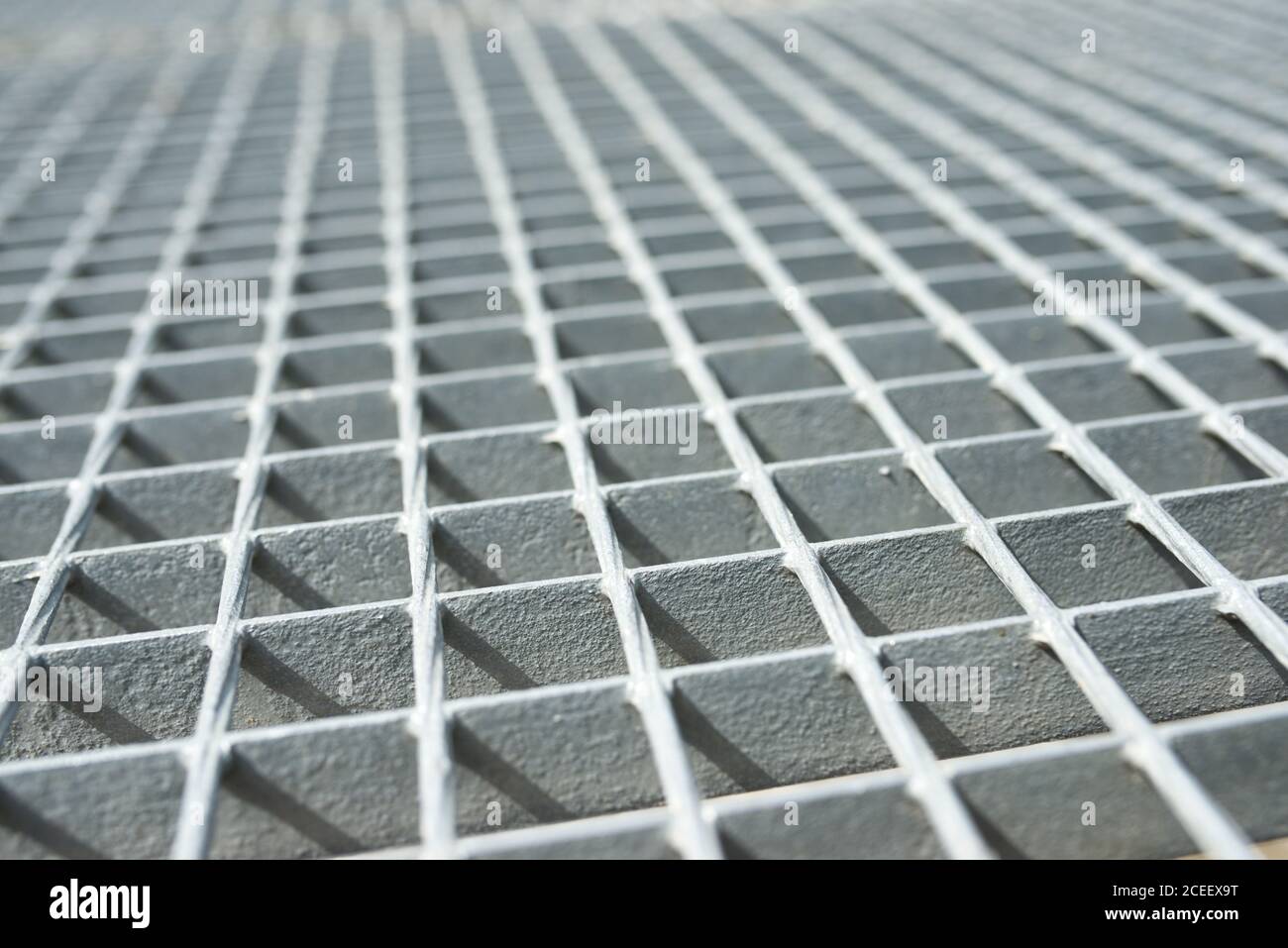 Close-up of a gray metal grating Stock Photo - Alamy