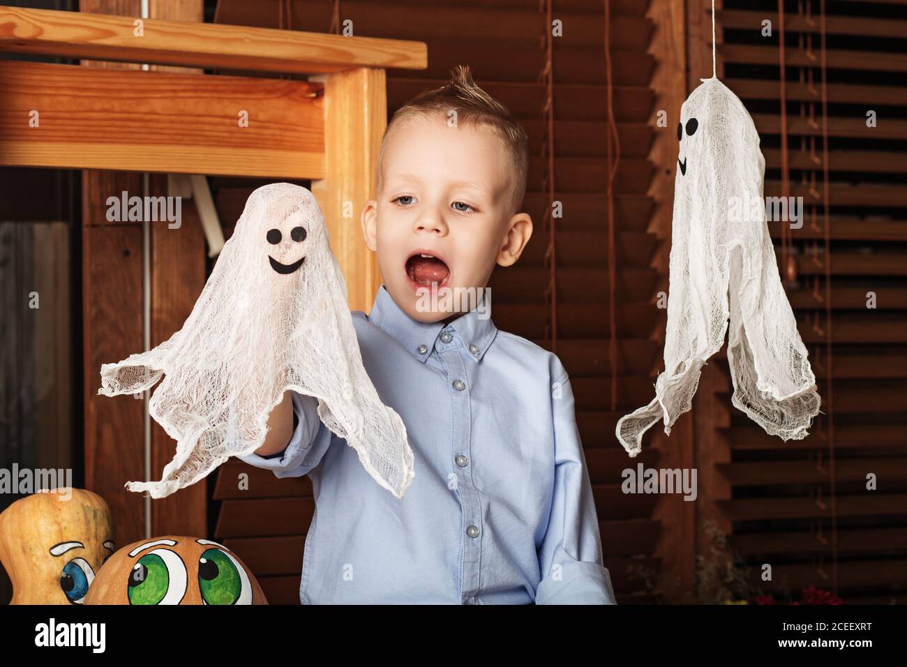 Cute Little Boy having fun in Halloween decorations. Halloween party ...