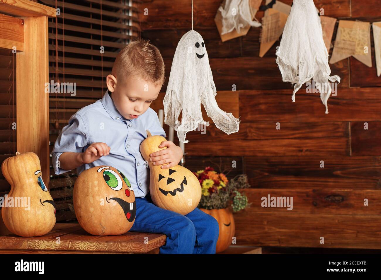 Adorable Cute Little Boy having fun in Halloween decorations Stock ...