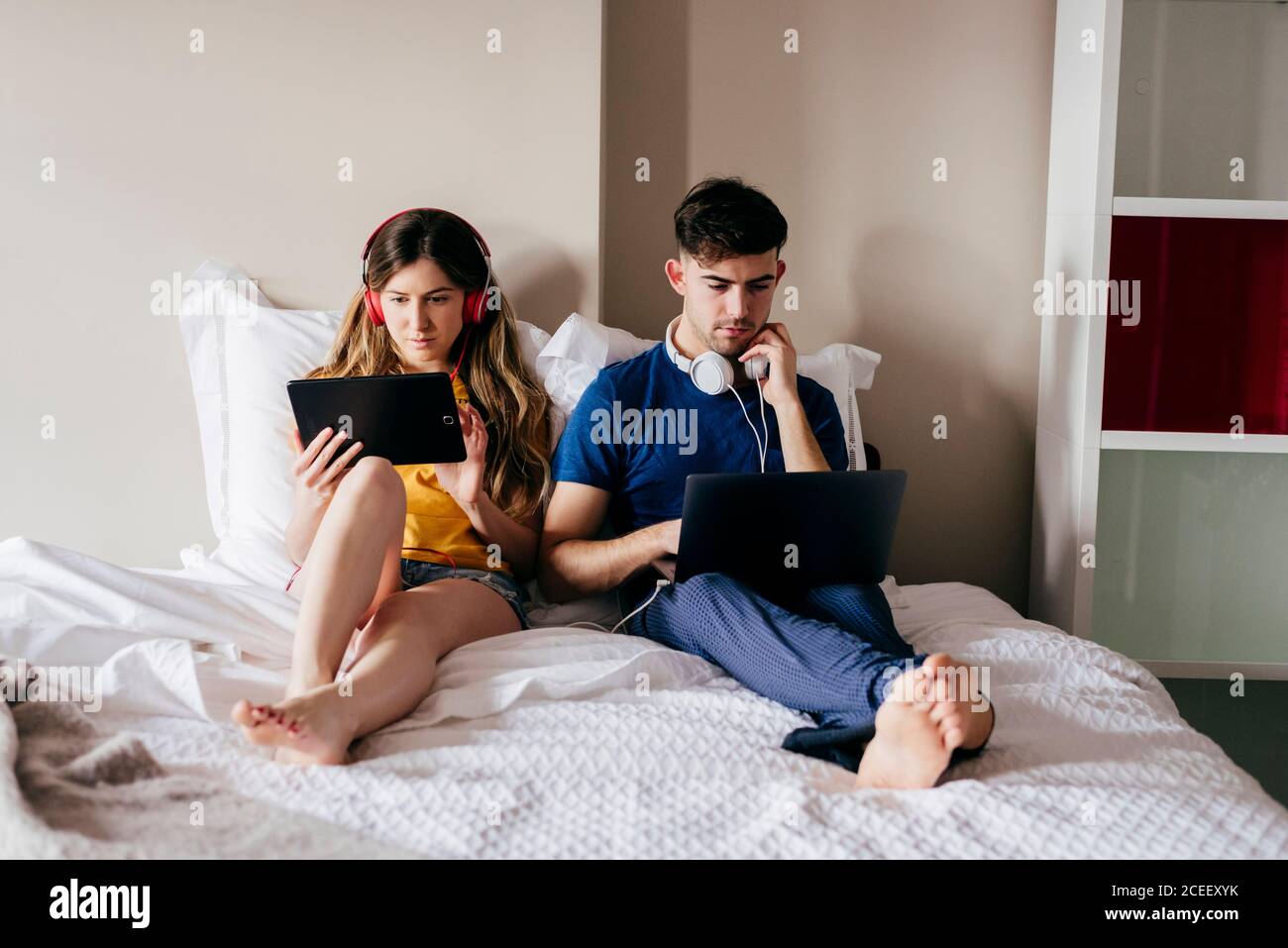 Couple gadgets lying on bed hi-res stock photography and images - Alamy
