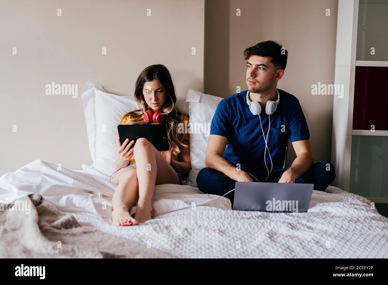 Couple gadgets lying on bed hi-res stock photography and images - Alamy